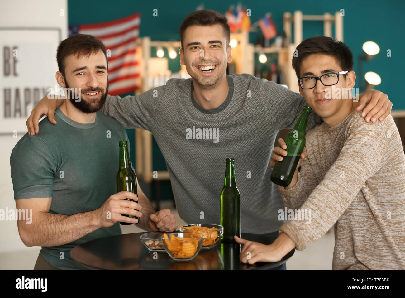 Men drinking beer in bar Stock Photo - Alamy