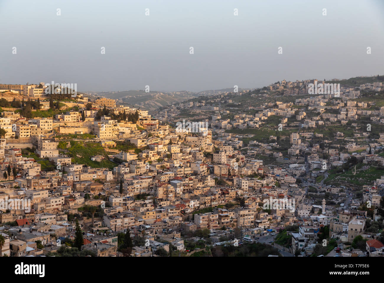 Aerial cityscape view of residential neighborhood during a sunny sunset ...