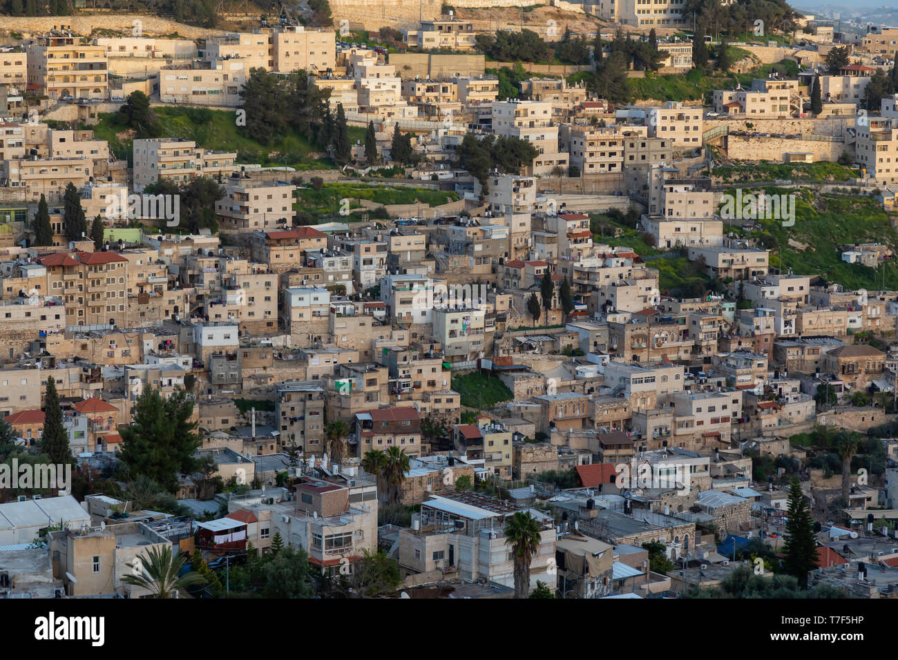 Aerial cityscape view of residential neighborhood during a sunny sunset ...