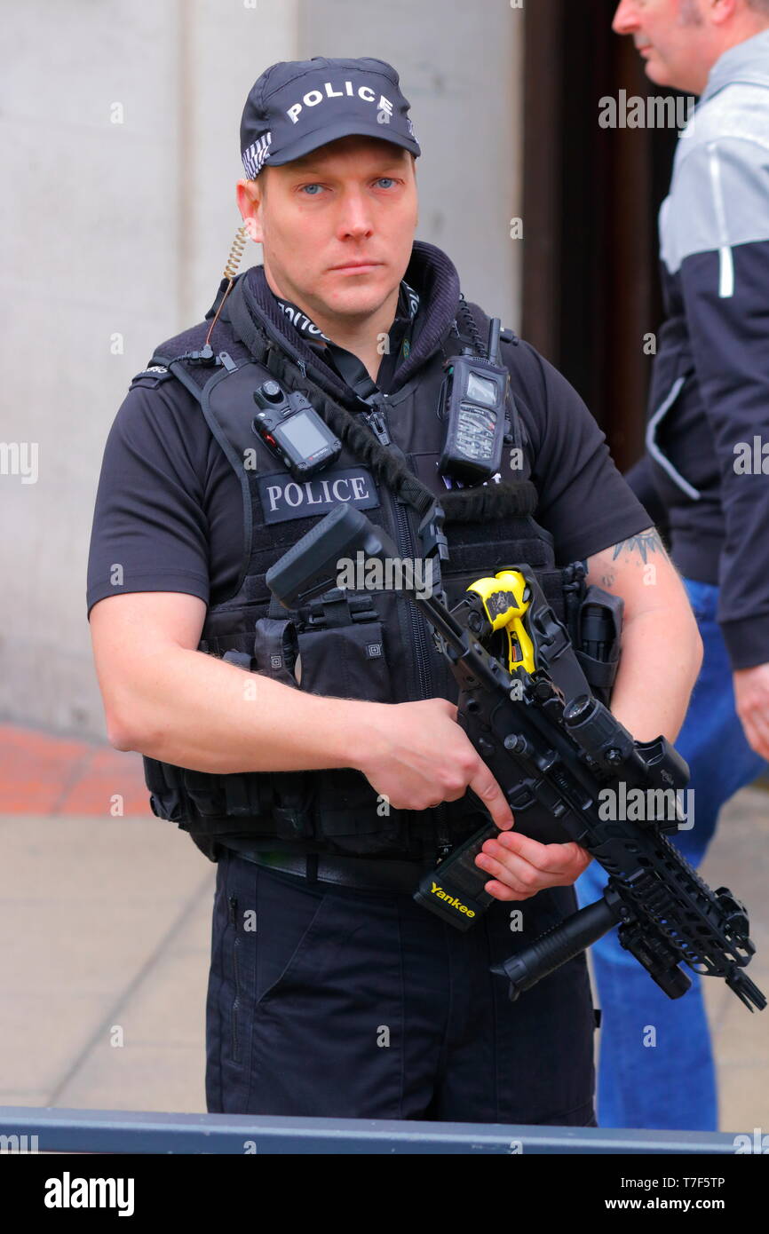 An armed police officer on duty during Tour De Yorkshire in Leeds City ...
