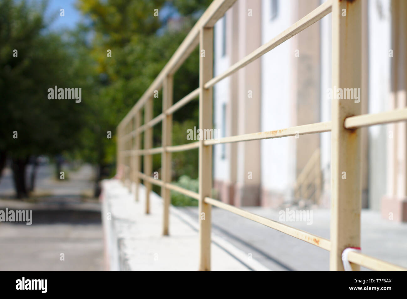 Abstract image of old rusty painted handrails receding into the ...