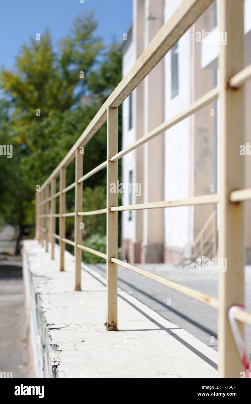 Abstract image of old rusty painted handrails receding into the ...