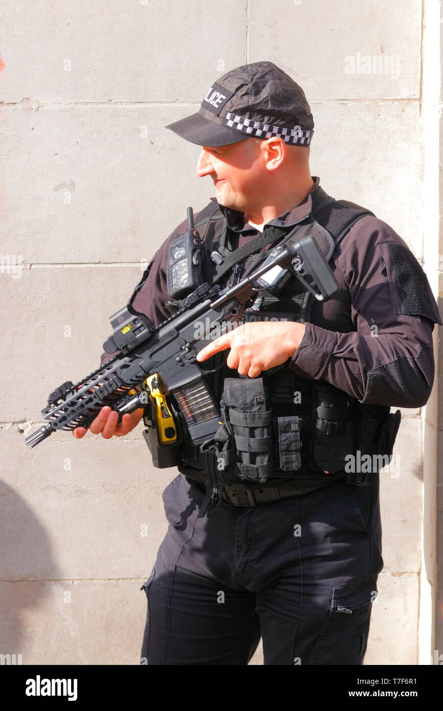 An armed police officer on duty during Tour De Yorkshire in Leeds City ...