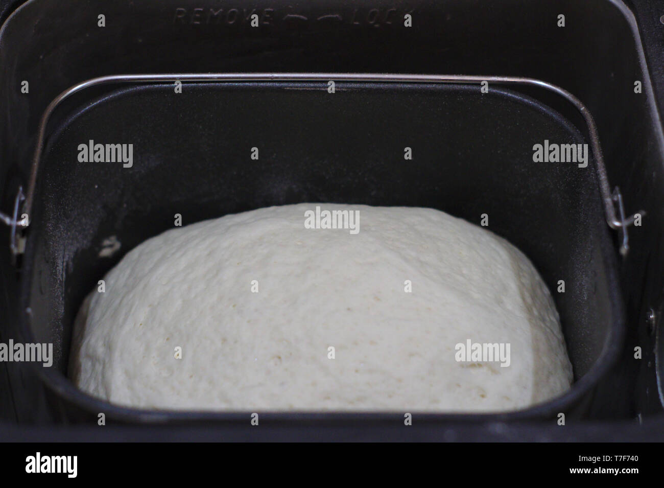 The process of making bread at home. Dough in bread maker Stock Photo ...
