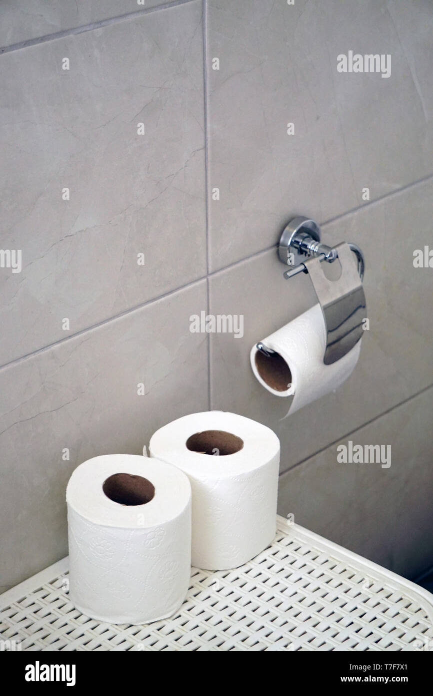 Toilet paper roll on white background Stock Photo - Alamy