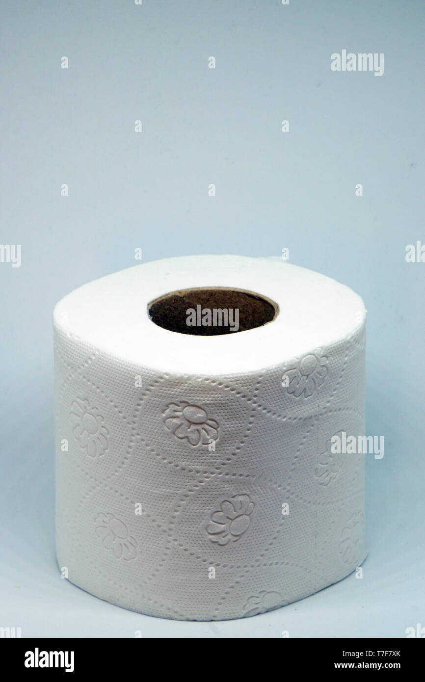 Toilet paper roll on white background Stock Photo - Alamy