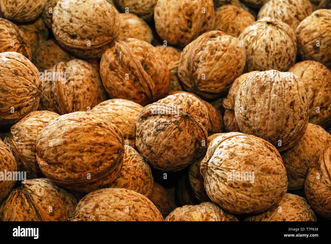 Walnuts in the basket close up view texture background Stock Photo - Alamy