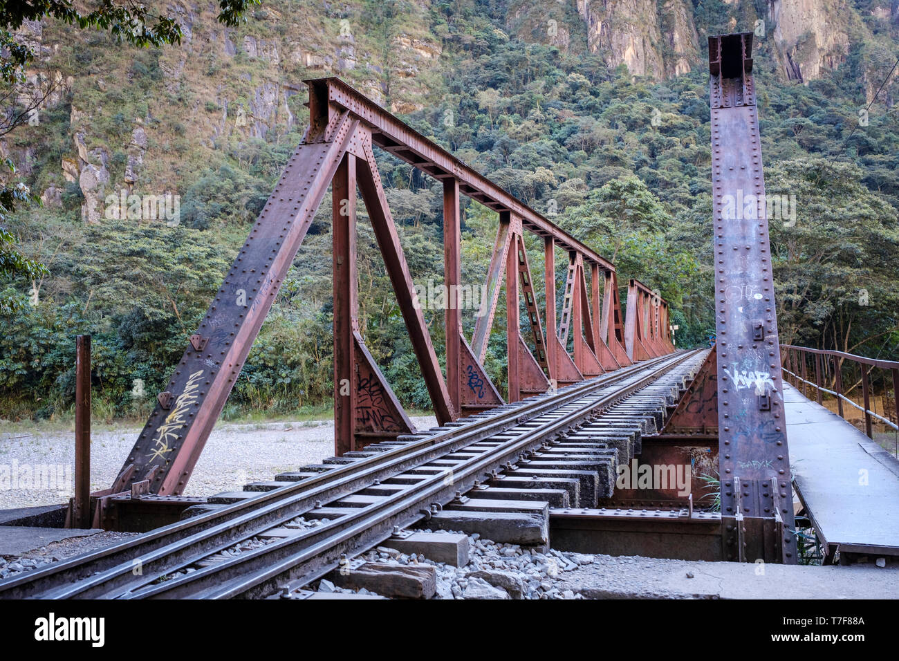 Metal bridge over Urubamba River on the railway to Aguas Calientes and ...