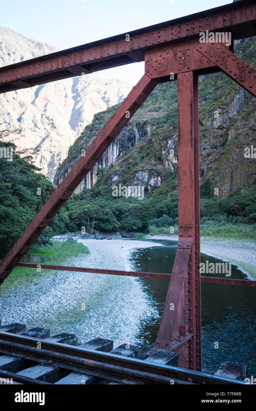 Metal bridge over Urubamba River on the railway to Aguas Calientes and ...