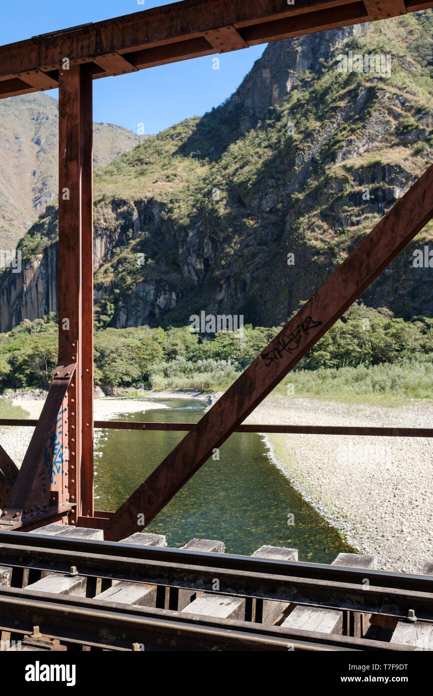 Metal bridge over Urubamba River on the railway to Aguas Calientes and ...