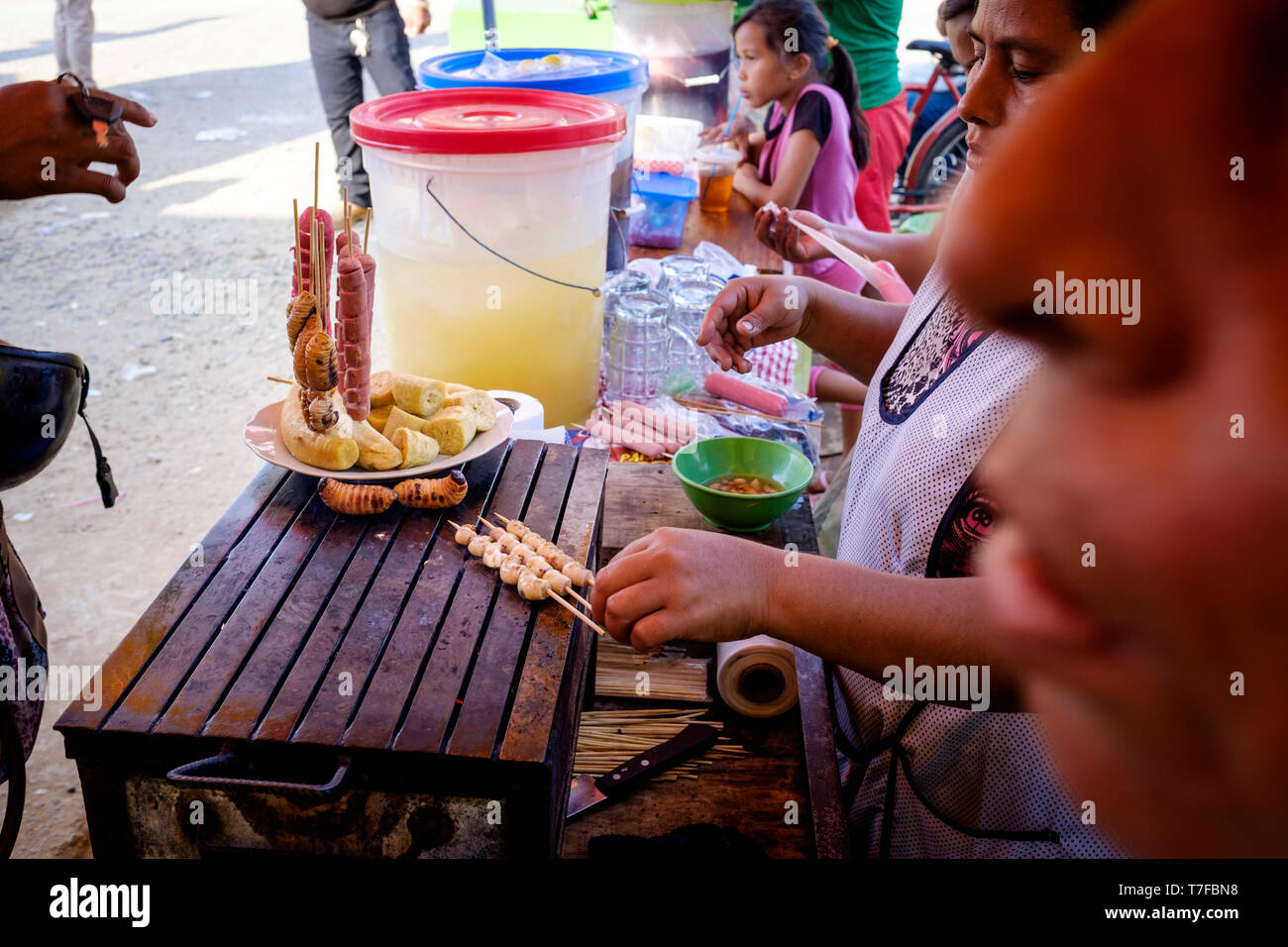 Sausages and delicious Suri (Palm tree worm) on a food stall on the ...