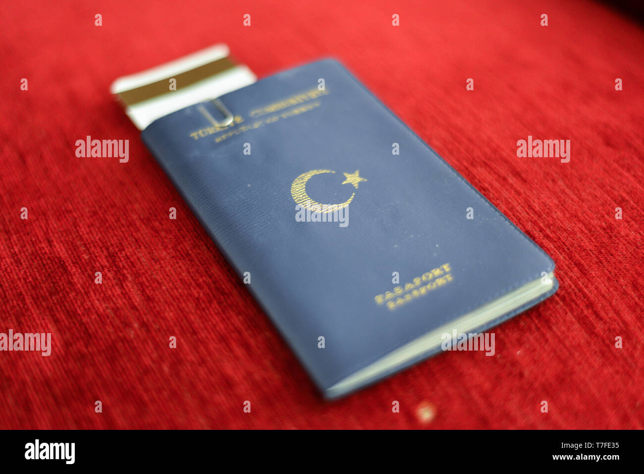 Turkish blue passport on red canvas background Stock Photo - Alamy