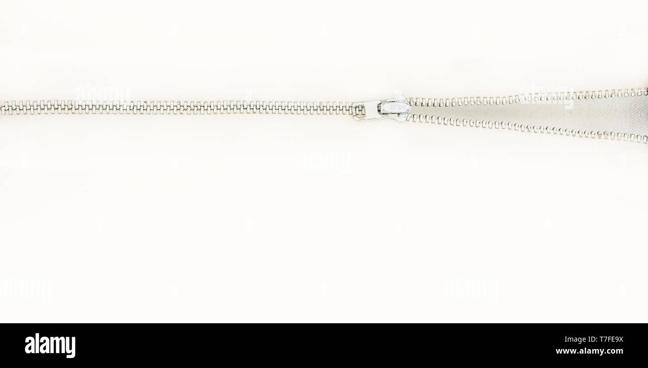 A zipper opening on a bright white background with lots of negative ...
