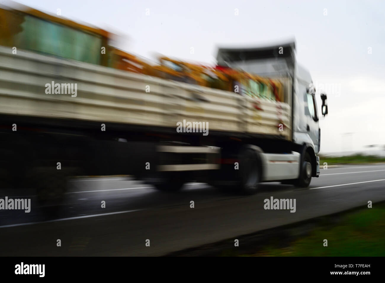 Truck passing by with panning effect on the road Stock Photo - Alamy