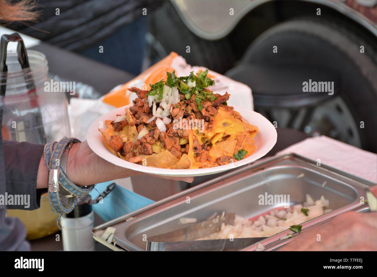 Nachos chips with cheese at fair for empty snack Stock Photo - Alamy