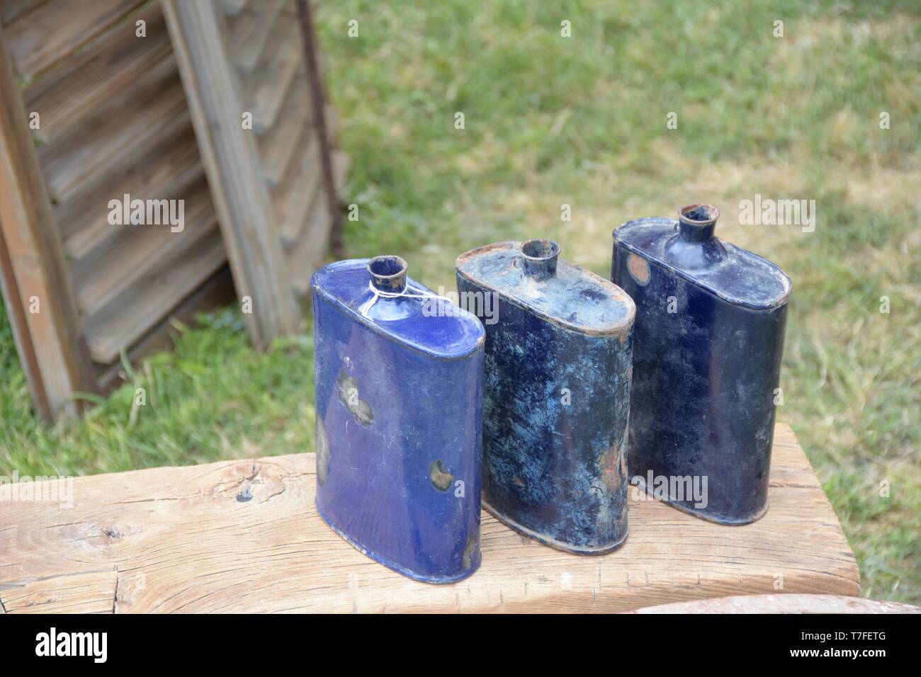 Old medal tin water canteens for decorations Stock Photo - Alamy
