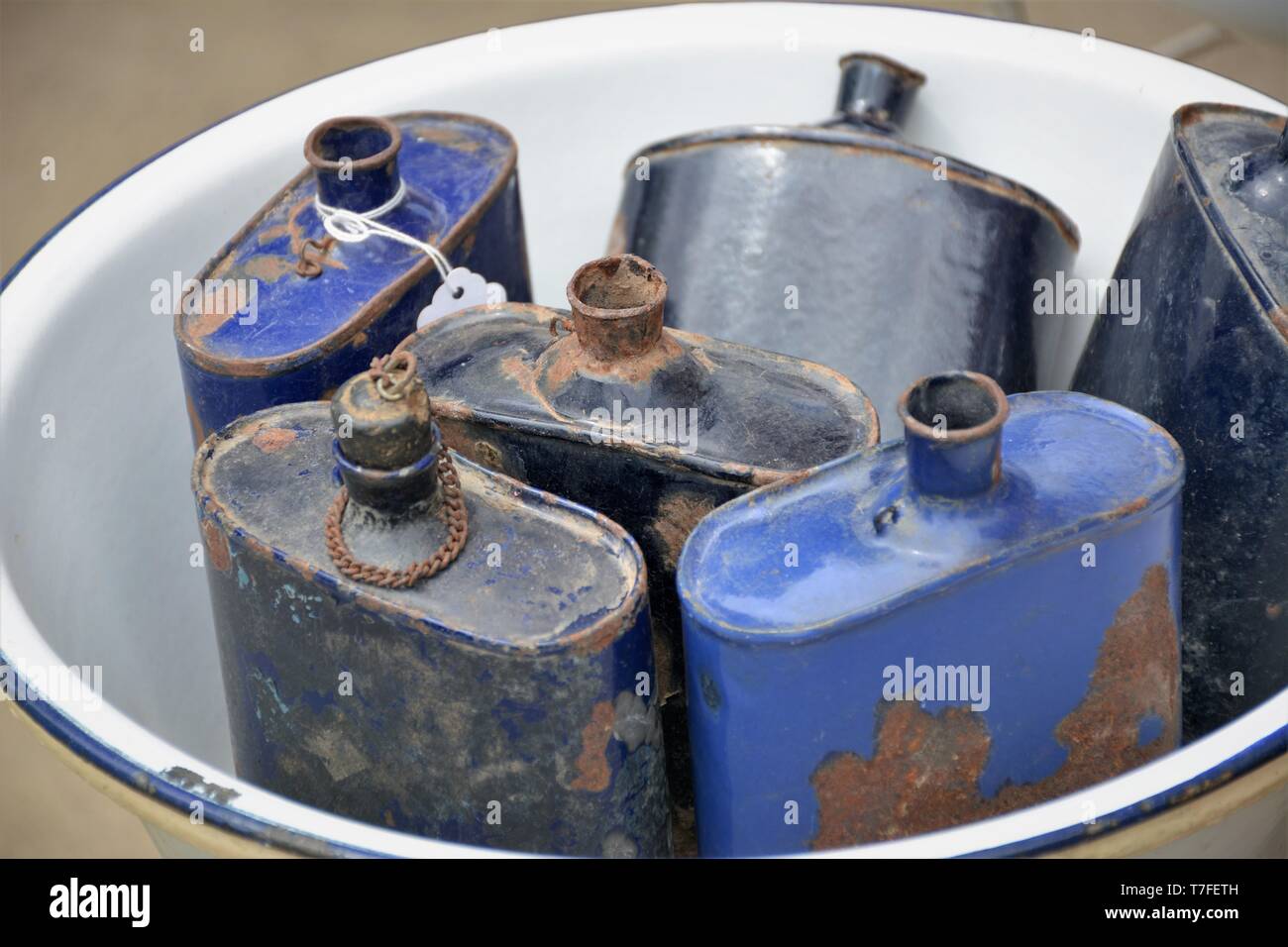Old medal tin water canteens for decorations Stock Photo - Alamy