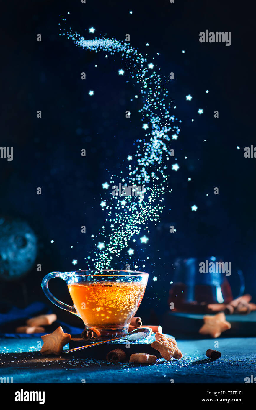 Sugar nebula creative food photo. Teacup with falling sugar forming ...