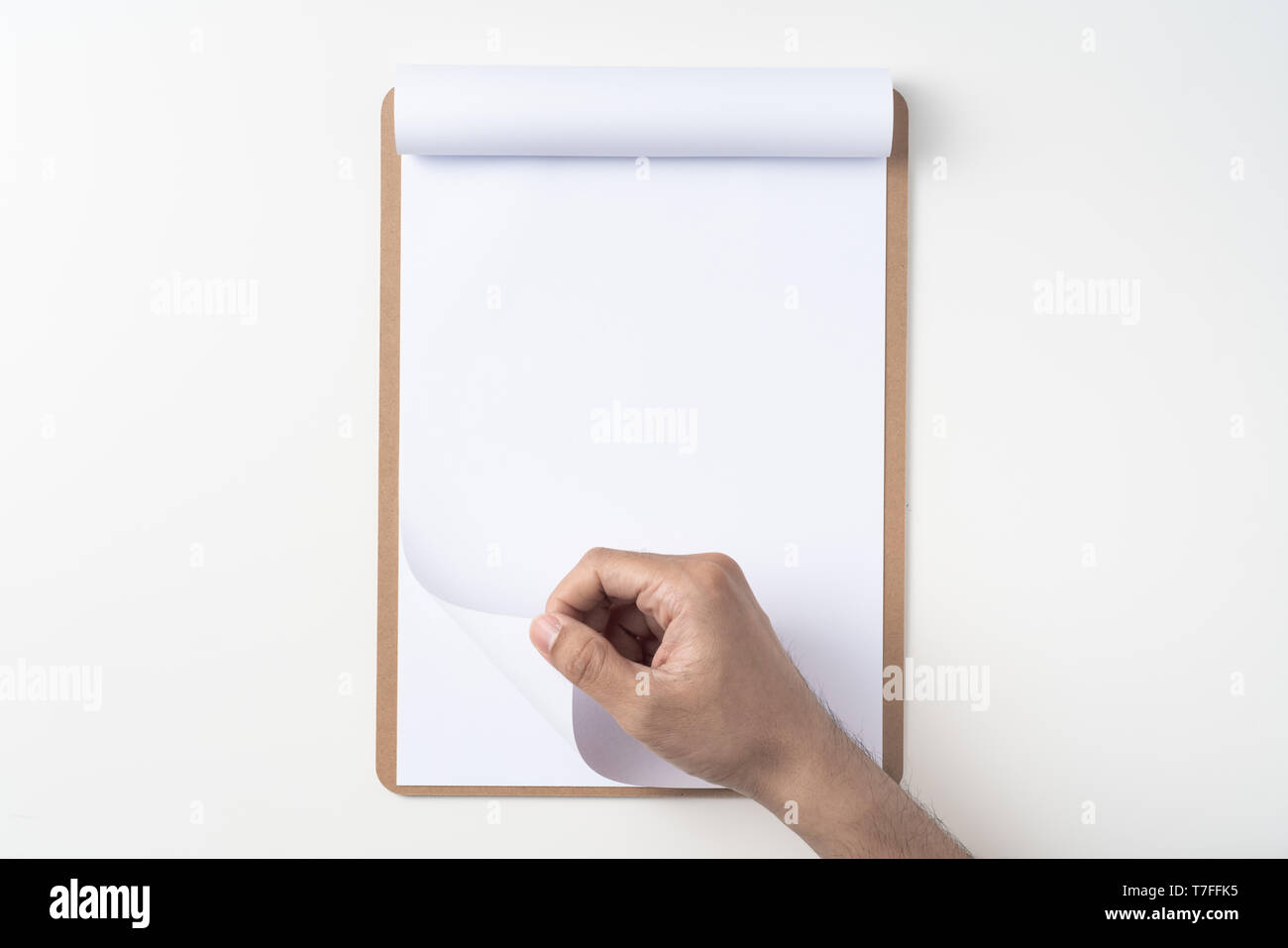 Design concept - top view of man hand hold white A4 flipped paper on ...