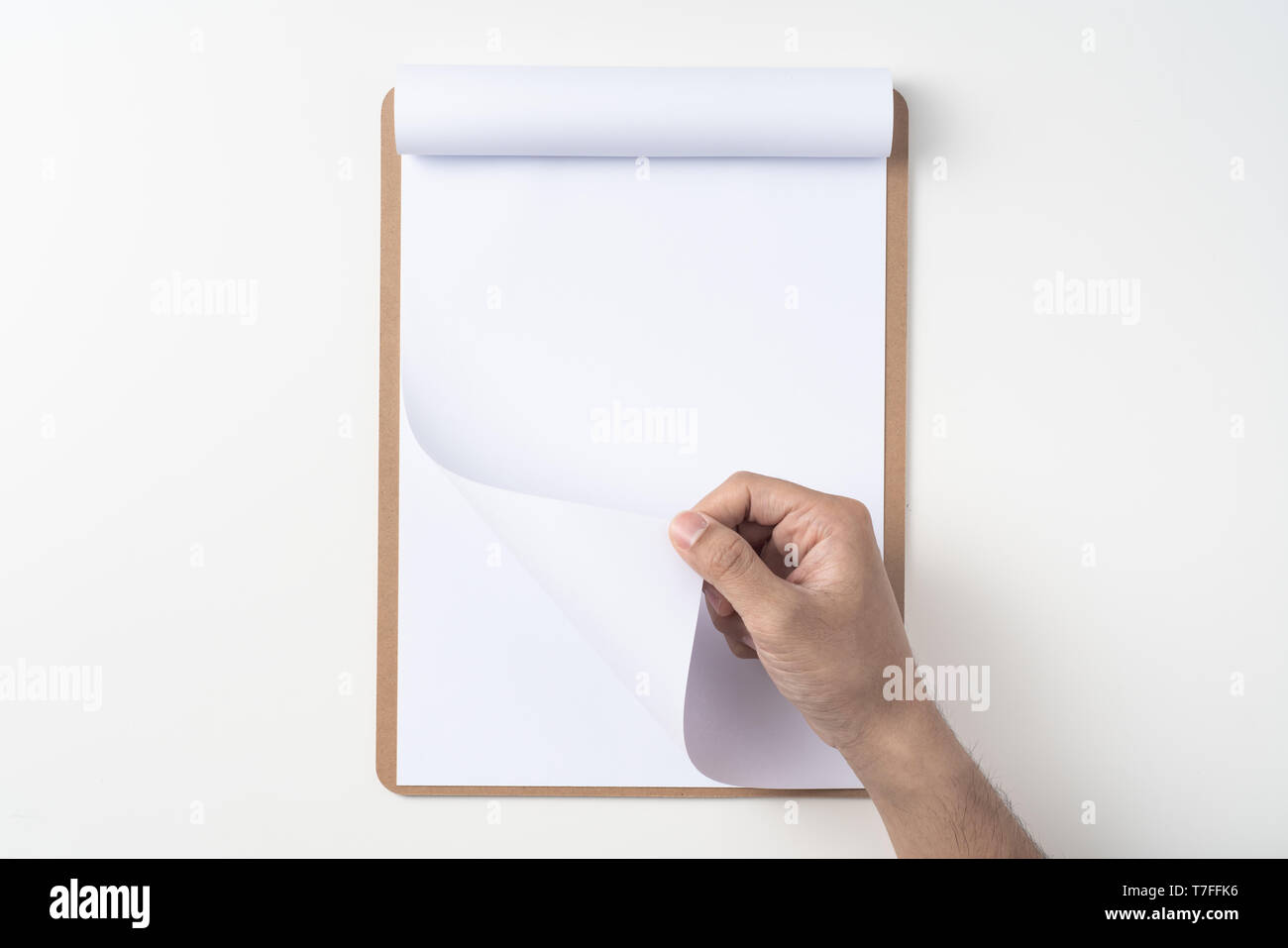 Design concept - top view of man hand hold white A4 flipped paper on ...