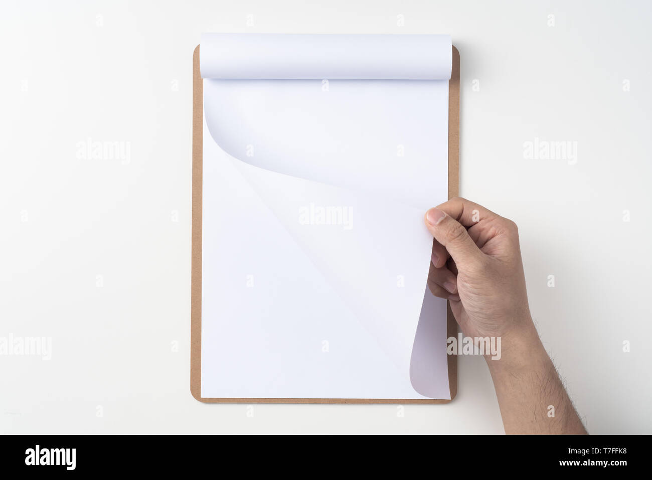 Design concept - top view of man hand hold white A4 flipped paper on ...