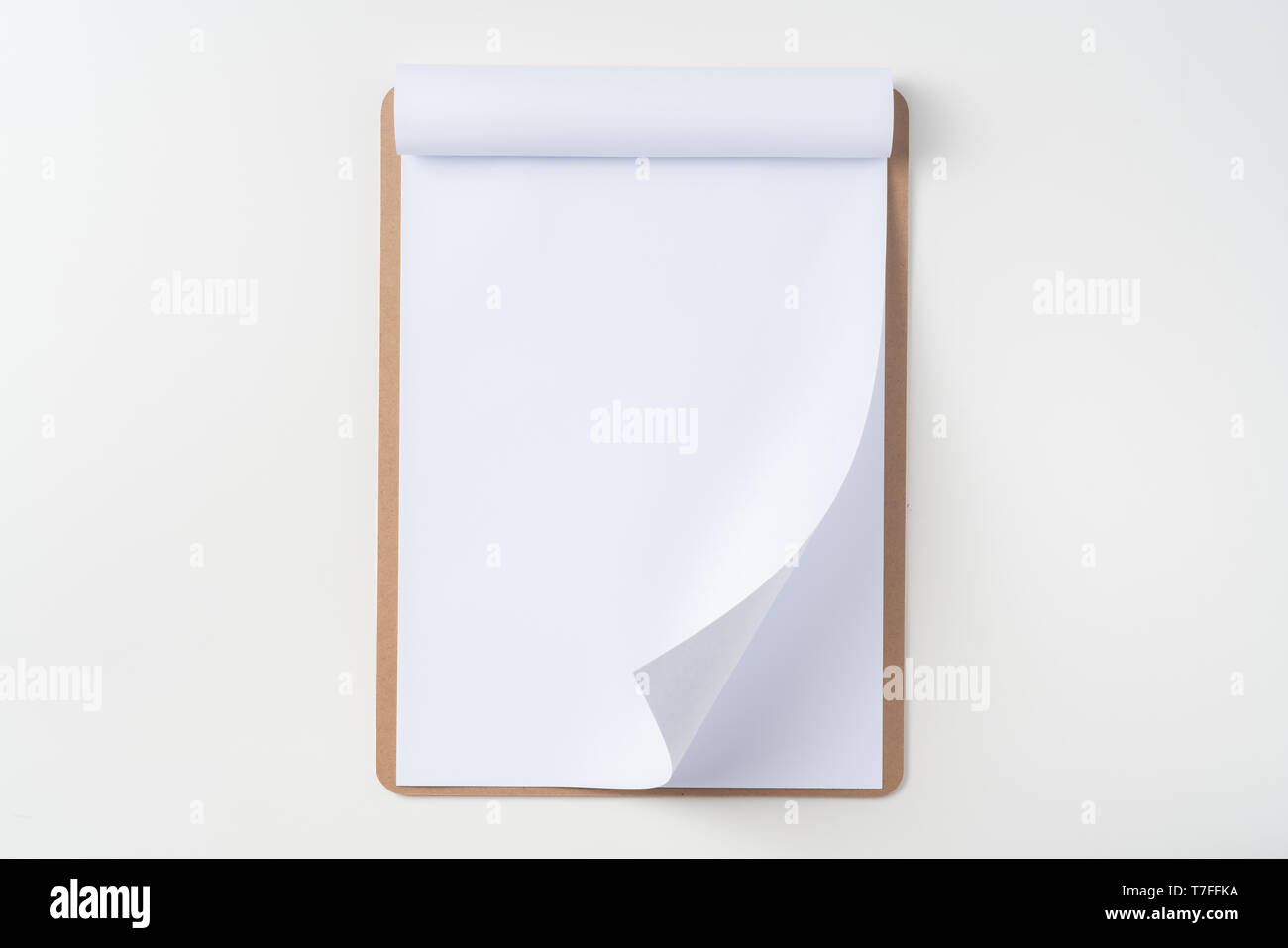 Design concept - top view of white A4 flipped paper on brown clipboard ...