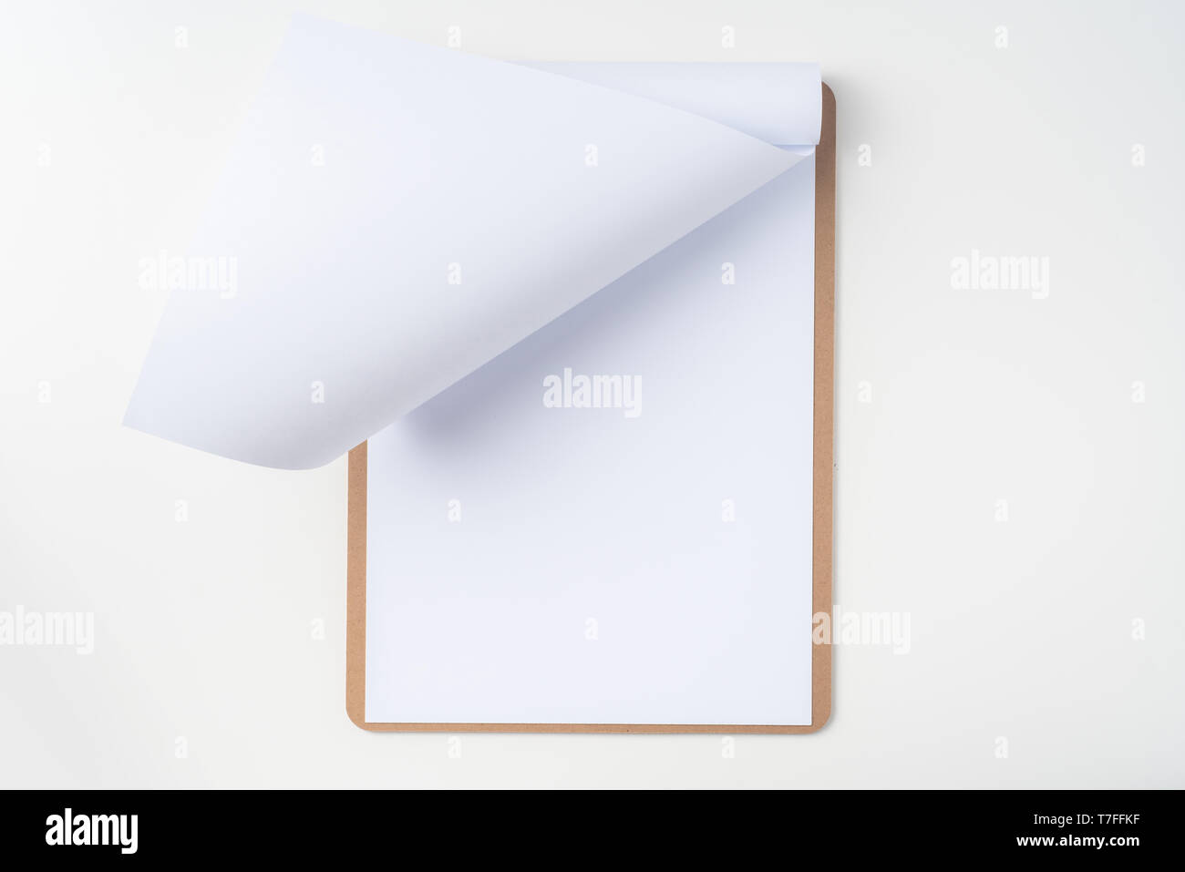 Design concept - top view of white A4 flipped paper on brown clipboard ...