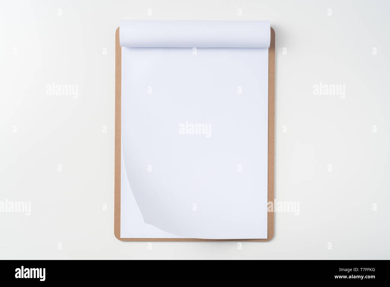 Design concept - top view of white A4 flipped paper on brown clipboard ...