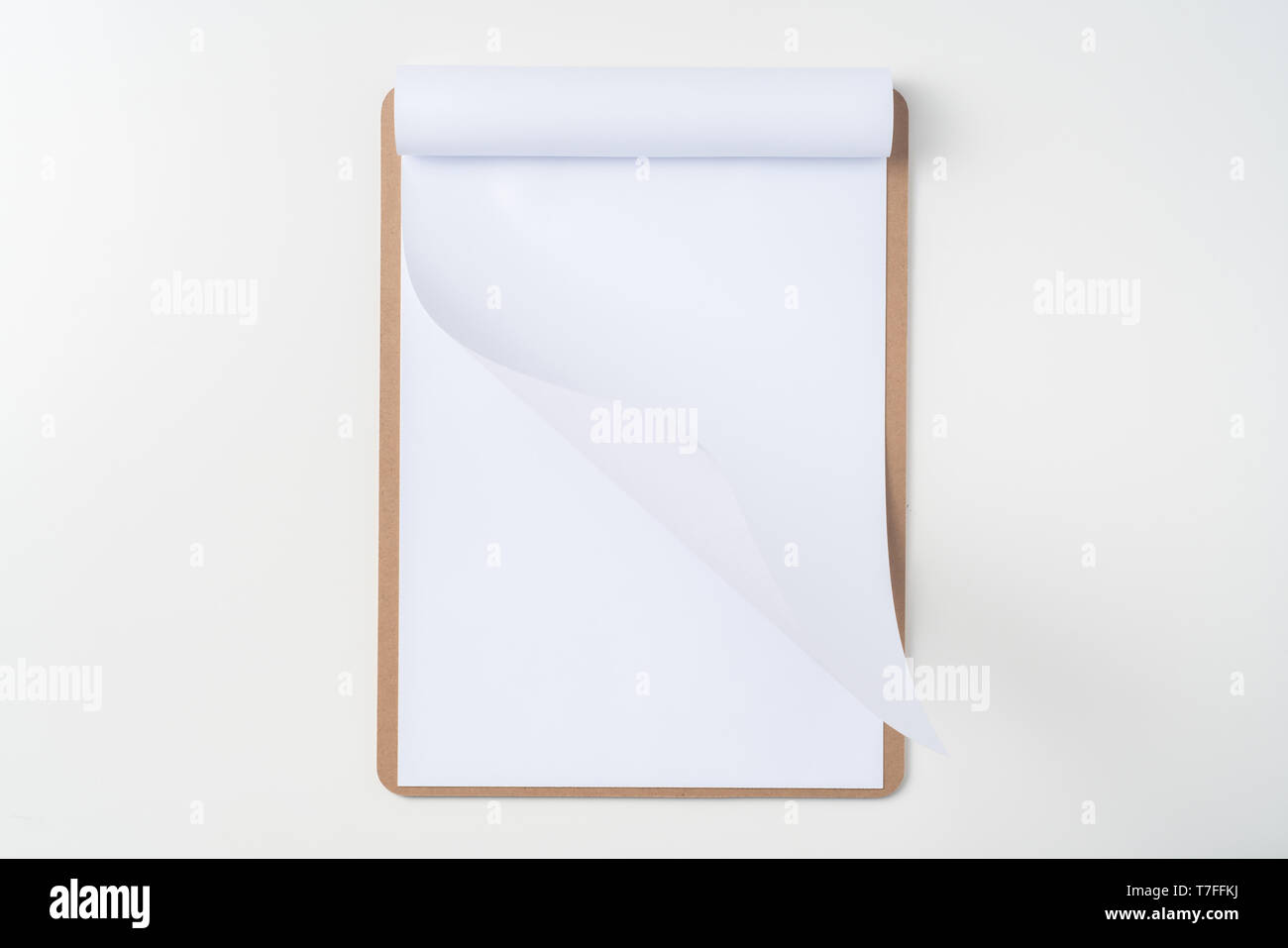 Design concept - top view of white A4 flipped paper on brown clipboard ...