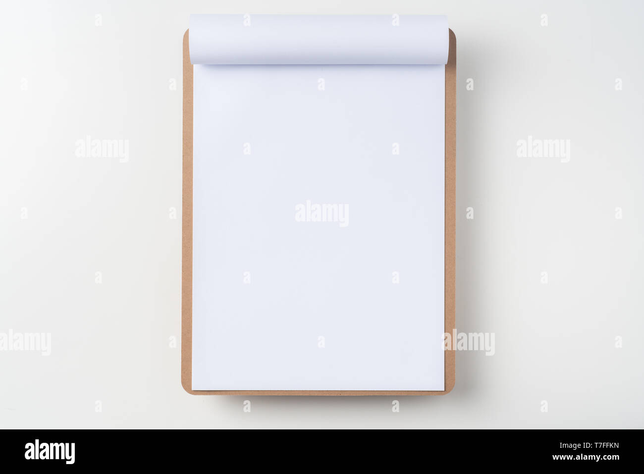 Design concept - top view of white A4 flipped paper on brown clipboard ...