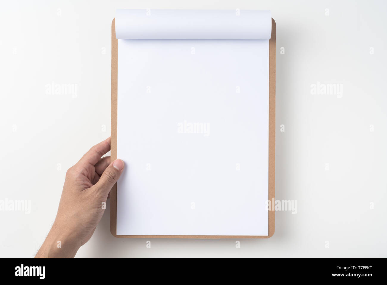 Design concept - top view of man hand hold white A4 flipped paper on ...