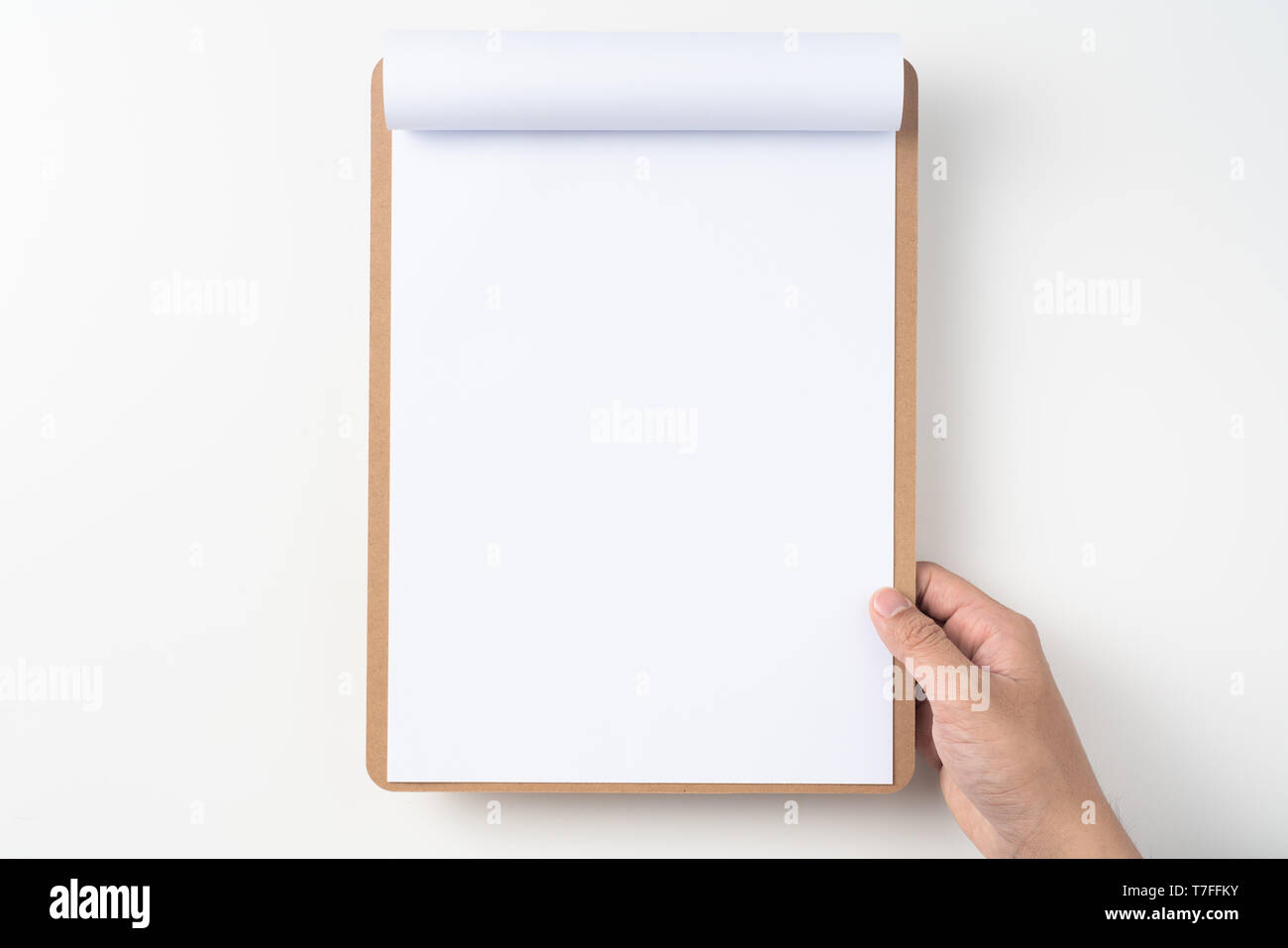 Design concept - top view of man hand hold white A4 flipped paper on ...
