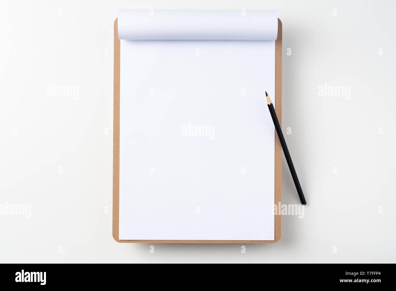 Design concept - top view of white A4 flipped paper on brown clipboard ...