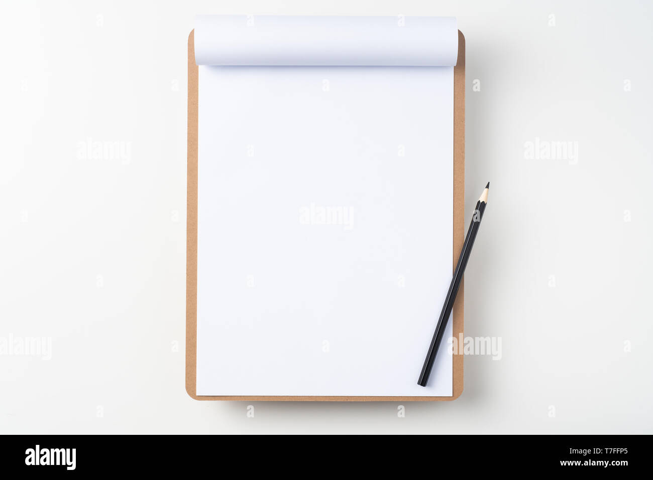 Design concept - top view of white A4 flipped paper on brown clipboard ...