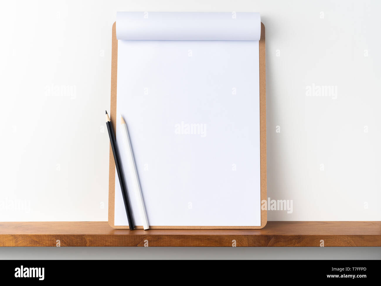 Design concept - top view of white A4 flipped paper on brown clipboard ...
