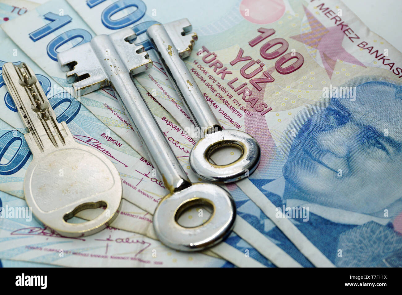 Turkish lira banknotes and assorted keys investment concept on isolated ...