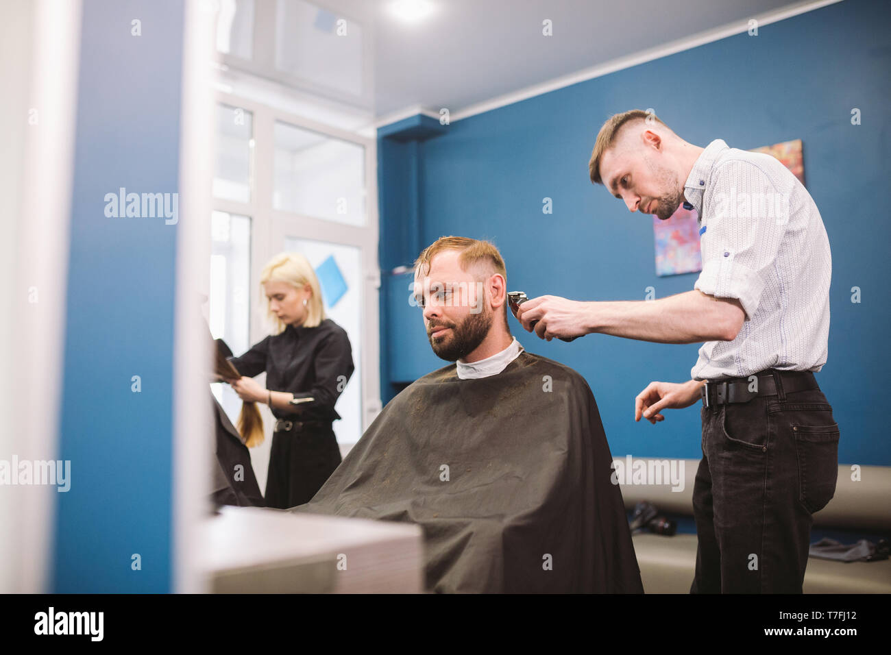 Inside busy barber shop hi-res stock photography and images - Alamy