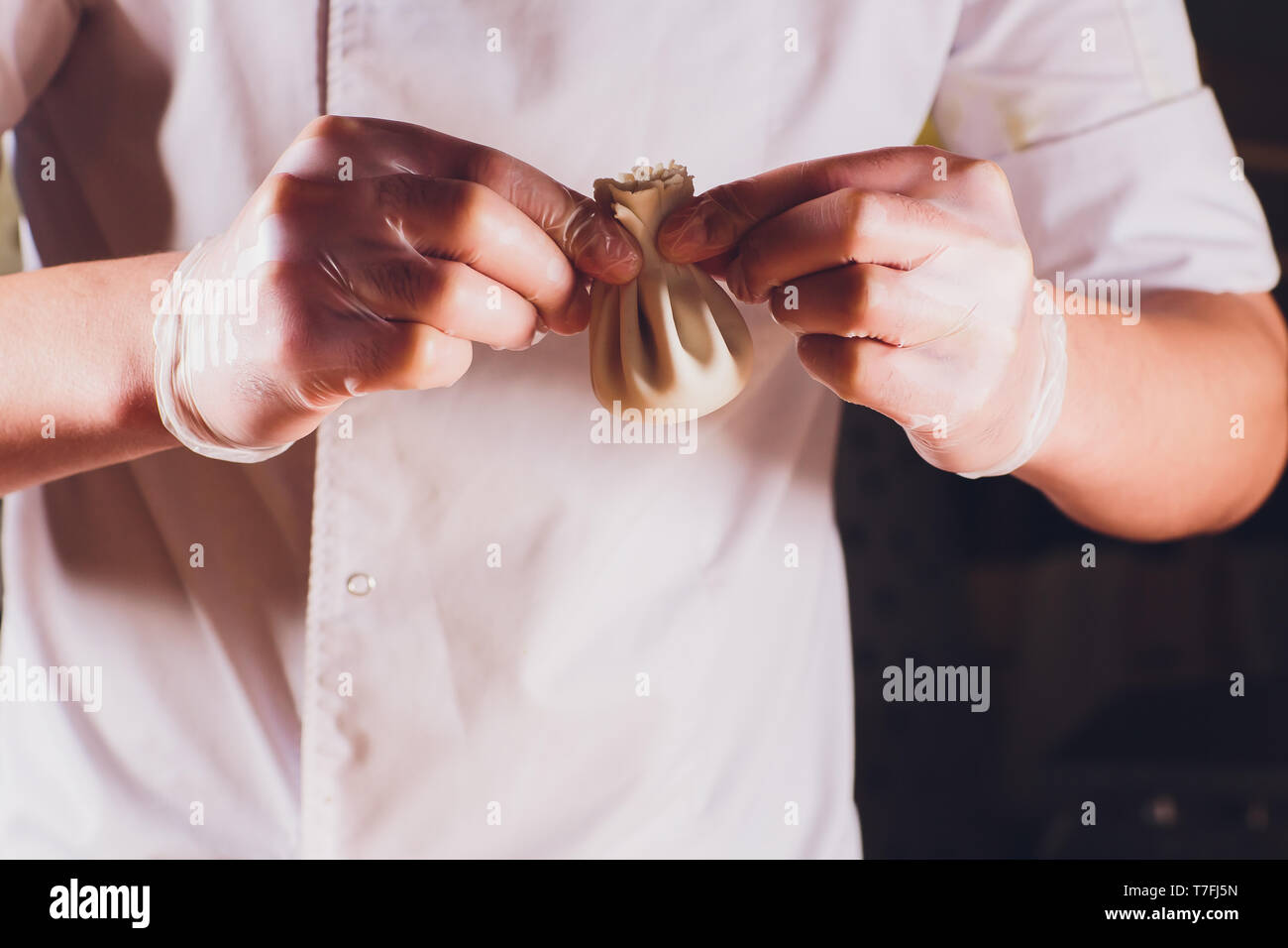 National Georgian cuisine Khinkali metal background Cook prepares ...