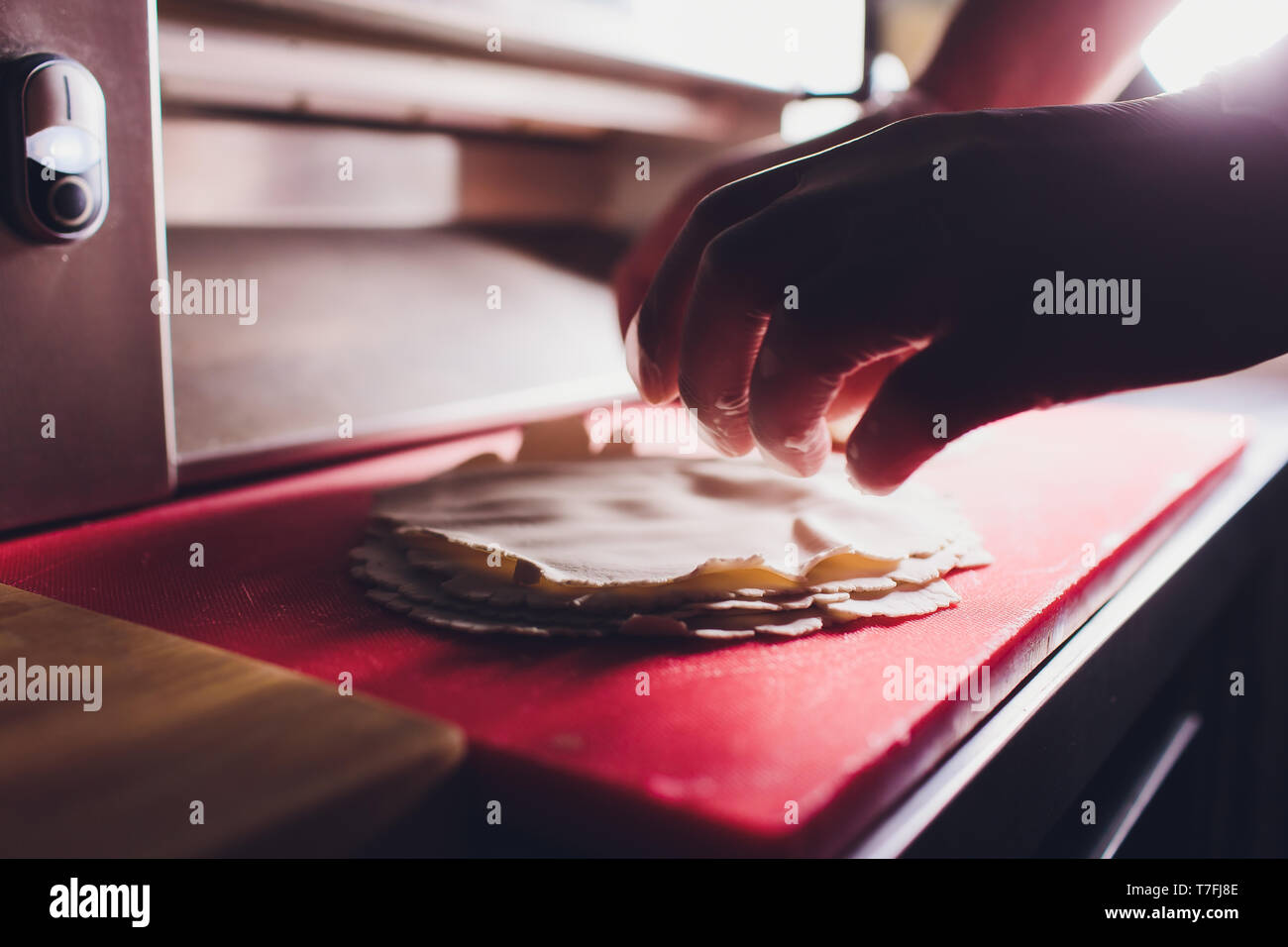 Chef making dough pastry sheeter bakery Baker forming shaping dough ...