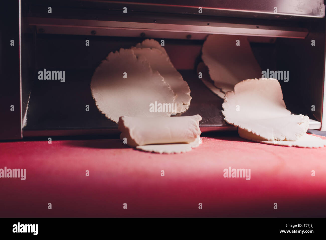 Chef making dough pastry sheeter bakery Baker forming shaping dough ...