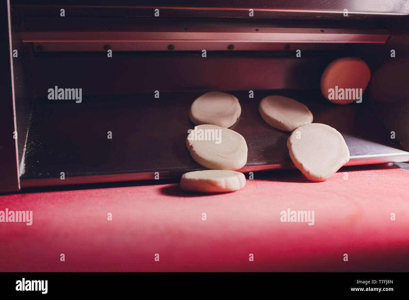 Chef making dough pastry sheeter bakery Baker forming shaping dough ...