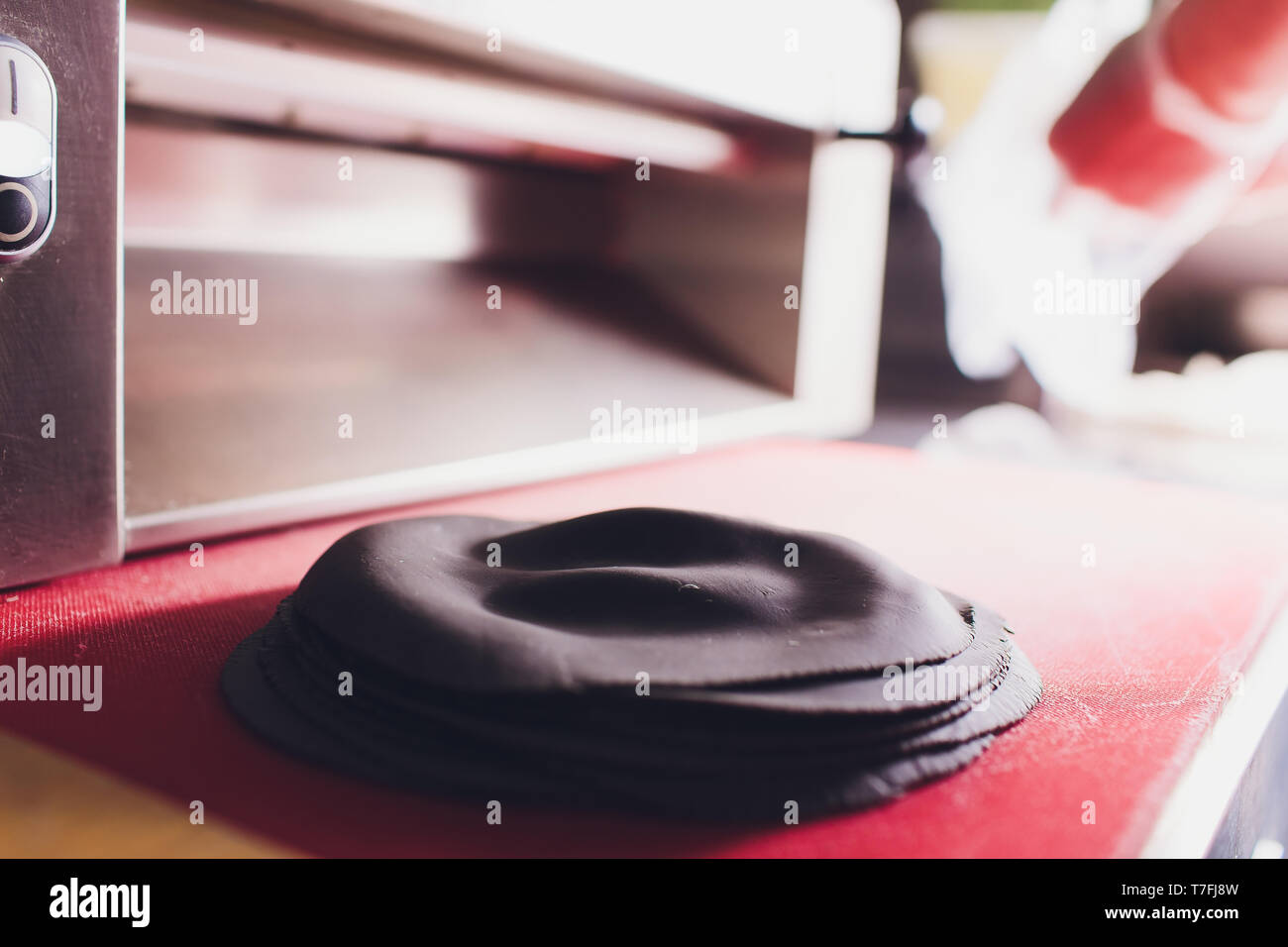 Chef making dough pastry sheeter bakery Baker forming shaping dough ...