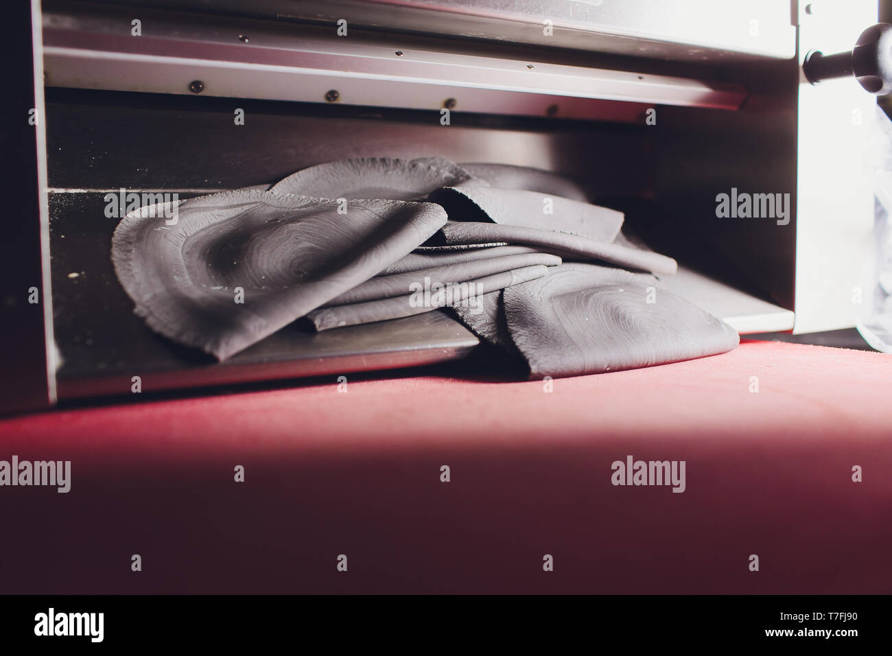 Chef making dough pastry sheeter bakery Baker forming shaping dough ...