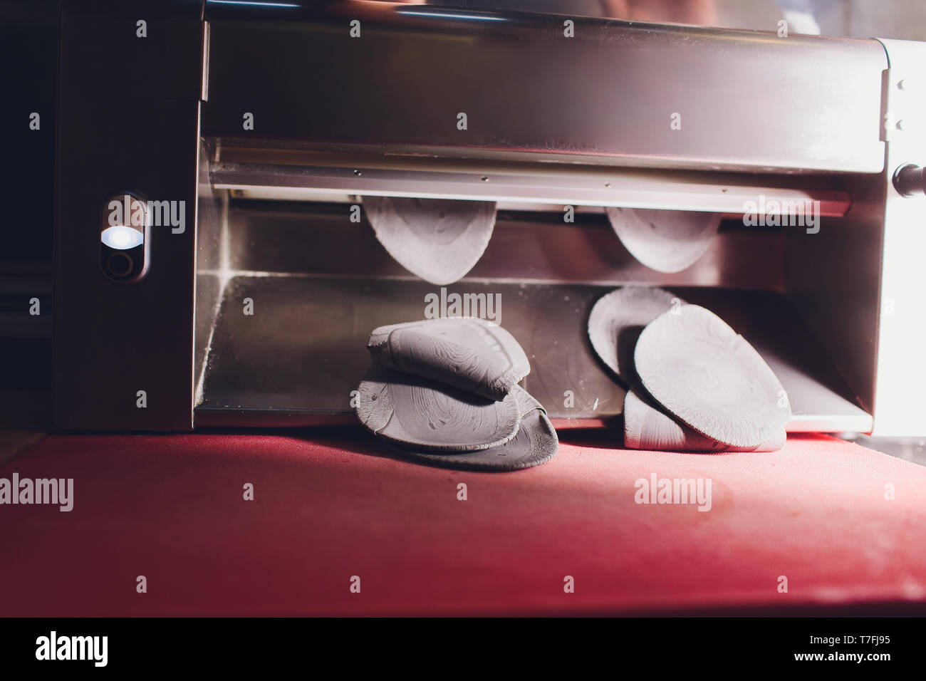 Chef making dough pastry sheeter bakery Baker forming shaping dough ...