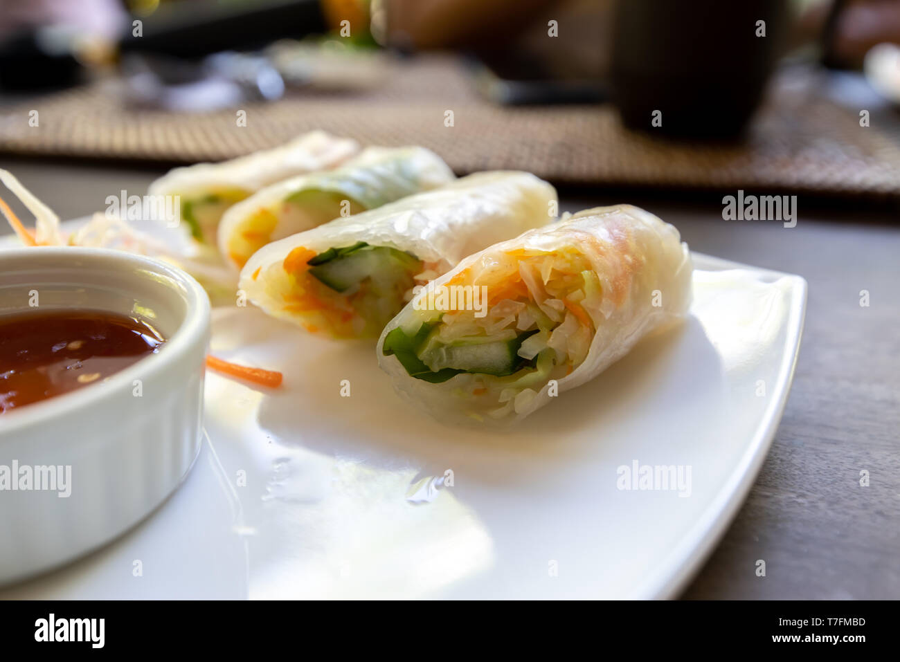 Thai style fresh spring roll with white plate Stock Photo - Alamy