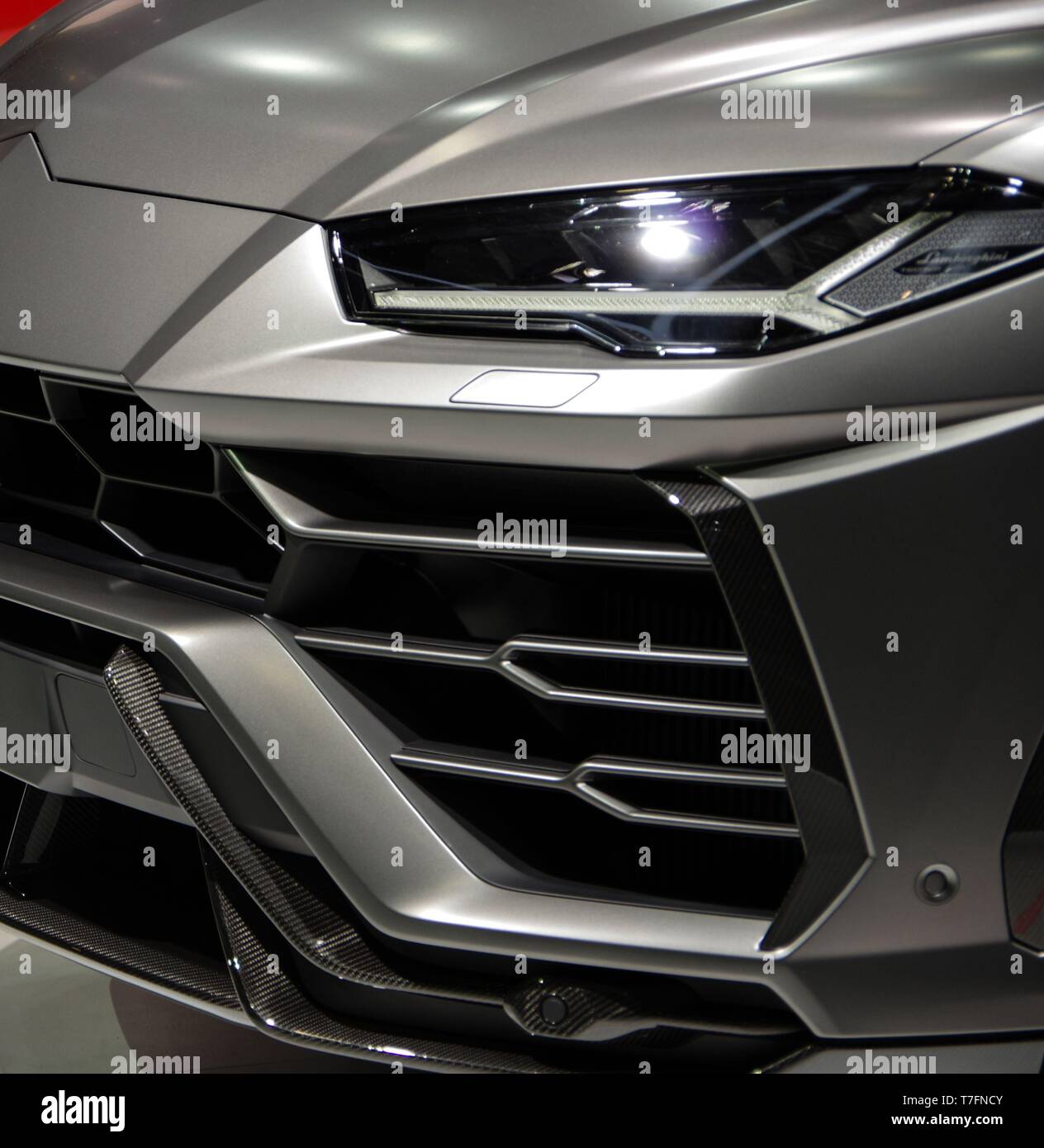 Modern gray suv car headlight details Stock Photo - Alamy