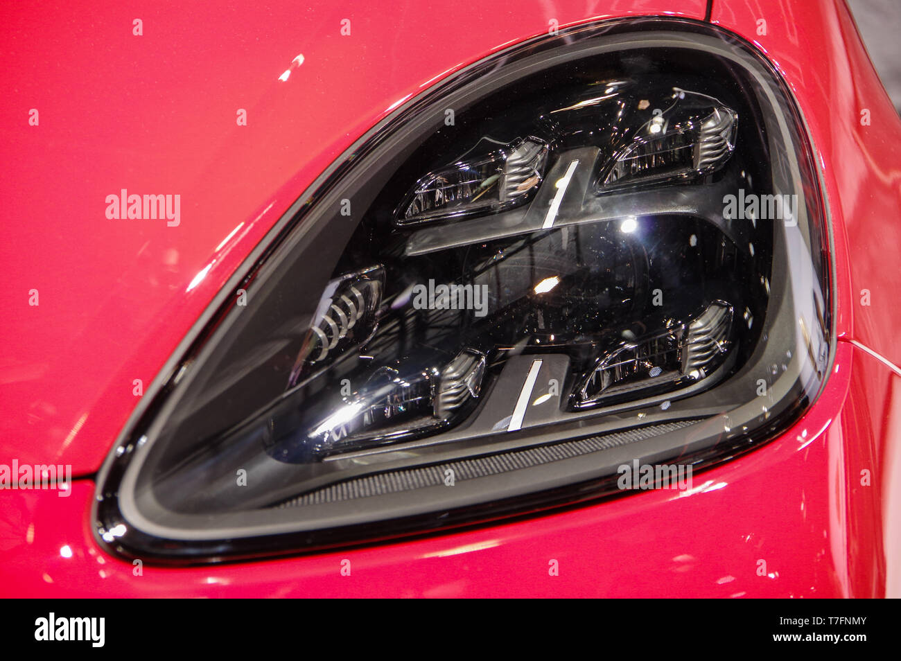 Modern red car headlight details Stock Photo - Alamy