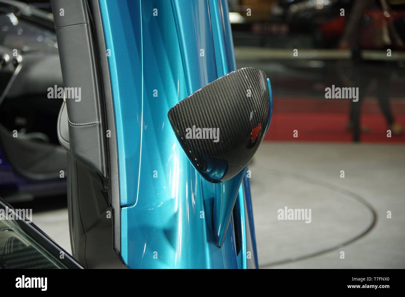 Modern blue car body carbon fiber rear view mirror detail Stock Photo ...