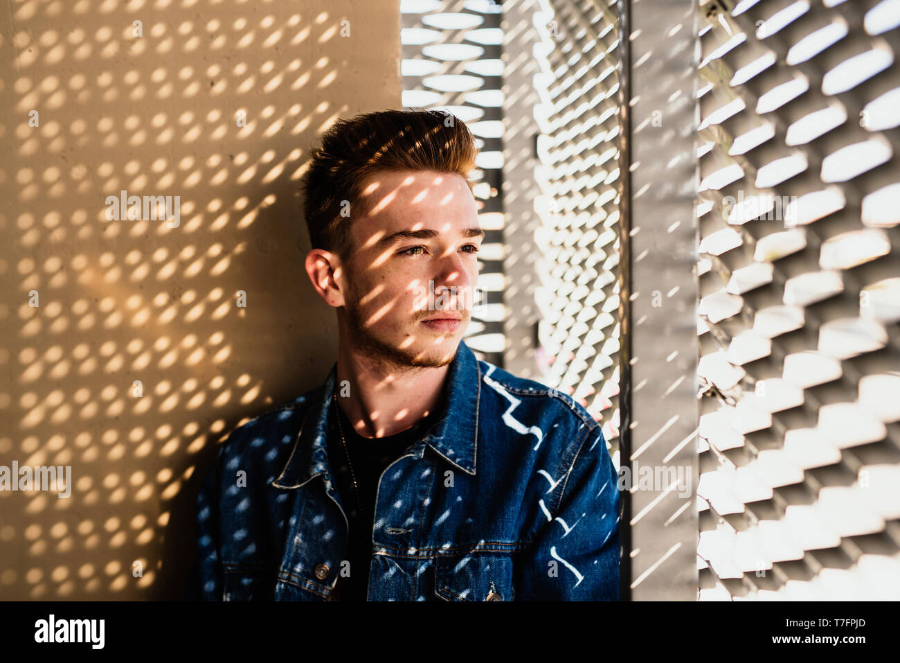 Young man with sunlight on his face Stock Photo - Alamy