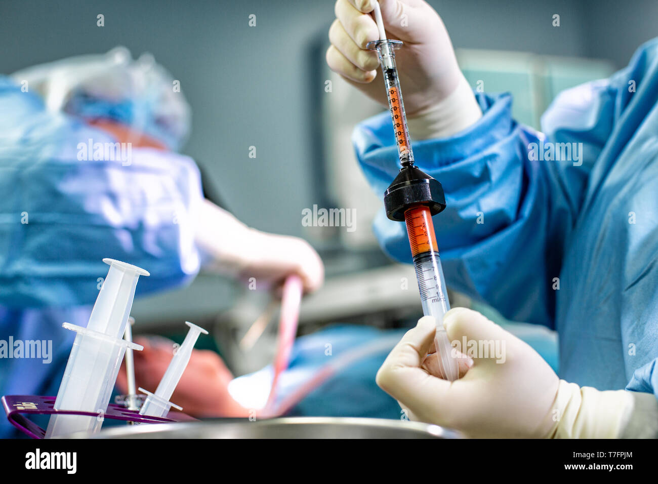 Hands Holding Syringe and Transfer Fat with Nano Fat Transfer Tool in ...